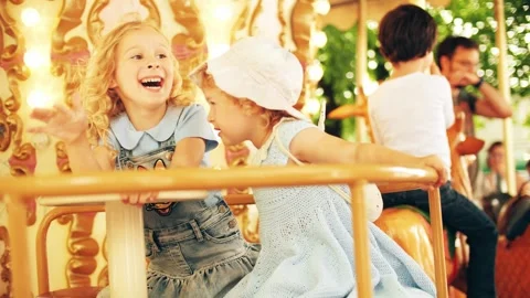 Two happy little girls ride a classic re... | Stock Video | Pond5