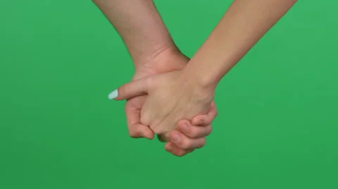 Two holding hands on green screen backgr... | Stock Video | Pond5