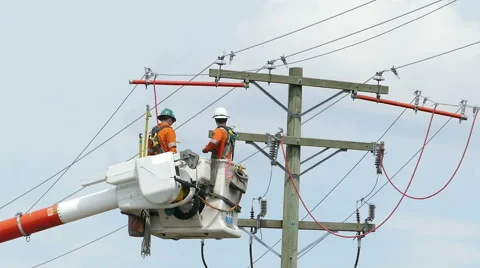 Two Hydro Linemen Adding New Wires On Te... | Stock Video | Pond5