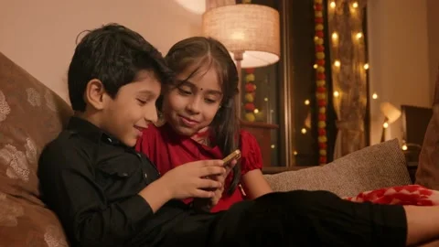 Two Indian children using mobile phone i... | Stock Video | Pond5
