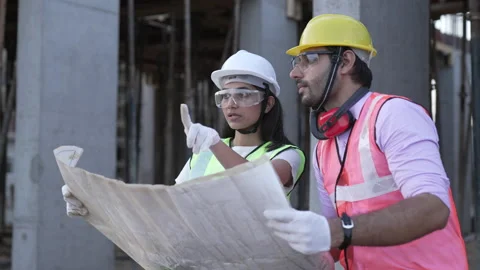 Two Indian engineers holding drawing pla... | Stock Video | Pond5