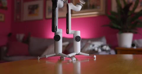 Two Insta360 Flow Gimbals On The Table -... | Stock Video | Pond5