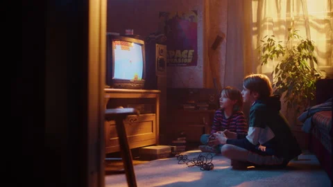 Two Kids Playing Nostalgic Arcade Game a... | Stock Video | Pond5