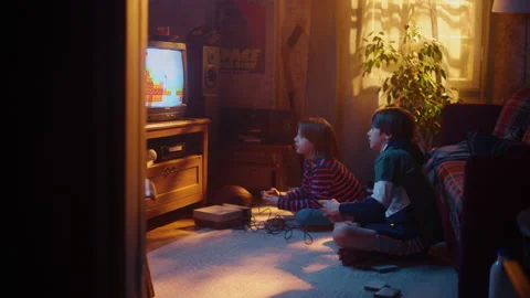 Two Kids Playing Nostalgic Arcade Game a... | Stock Video | Pond5