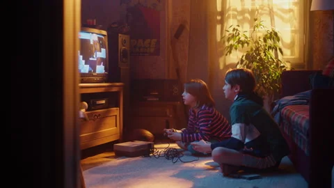 Two Kids Playing Nostalgic Arcade Game a... | Stock Video | Pond5