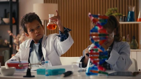 Two kids playing as scientists, observin... | Stock Video | Pond5