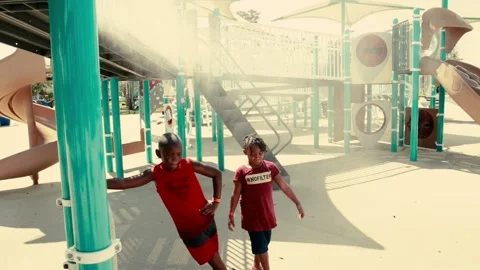 Two kids playing in water mist (slow mot... | Stock Video | Pond5