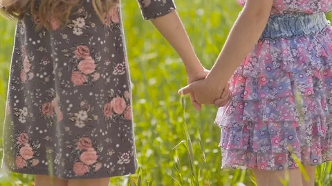 Two little girls best friends holding ha... | Stock Video | Pond5