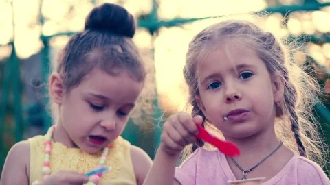 Two little girls with curly beautiful ha... | Stock Video | Pond5