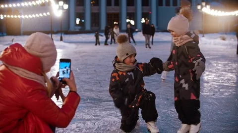 Two little kids dancing on the ice rink ... | Stock Video | Pond5