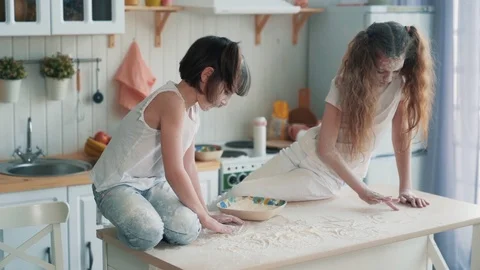 Two little sisters cooking in kitchen, d... | Stock Video | Pond5