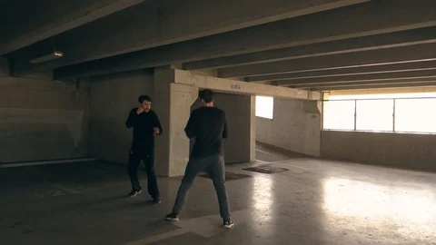 Two male actors rehearse a fight scene i... | Stock Video | Pond5