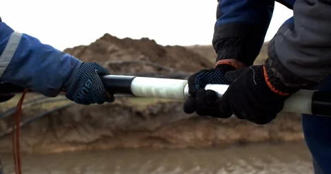 Two men are connecting the cables in the... | Stock Video | Pond5