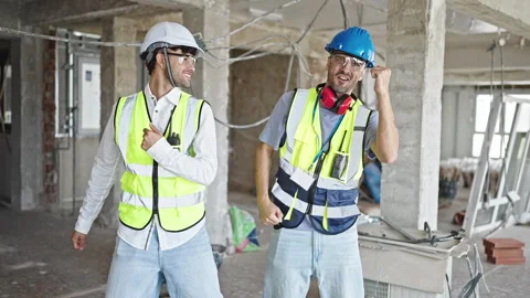 Two men builders smiling confident danci... | Stock Video | Pond5