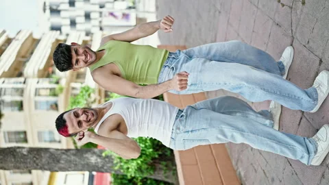 Two men couple smiling confident dancing... | Stock Video | Pond5