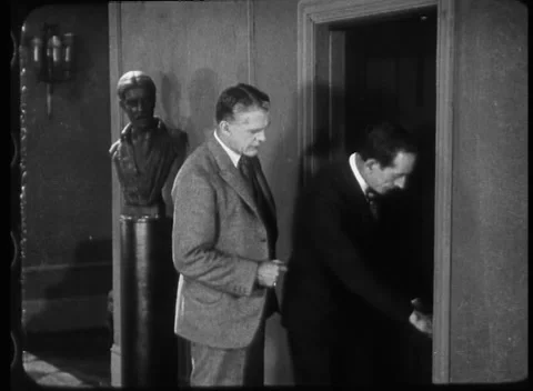 Two men exiting room and meeting scared ... | Stock Video | Pond5