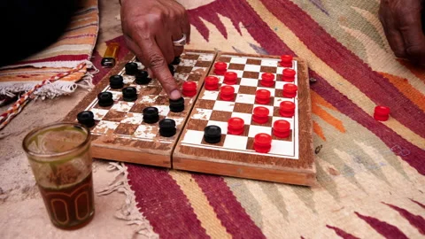 Two men play dama game, checkers, in Mor... | Stock Video | Pond5