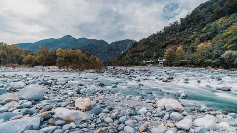Two merging rivers at the base of the mo... | Stock Video | Pond5