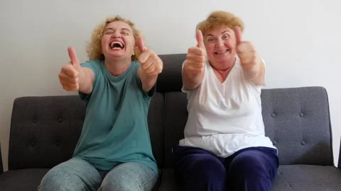 Two middle-aged Women sitting on sofa, m... | Stock Video | Pond5