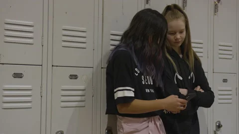 Two Middle School Girls Stand in Front o... | Stock Video | Pond5