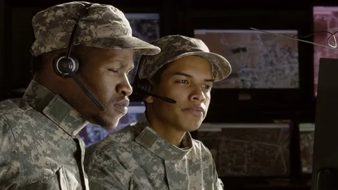 Two military drone operators consulting ... | Stock Video | Pond5