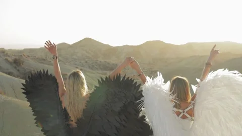 Two models, one with white angel wings a... | Stock Video | Pond5