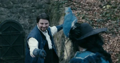 Two musketeers fencing background door | Stock Video | Pond5
