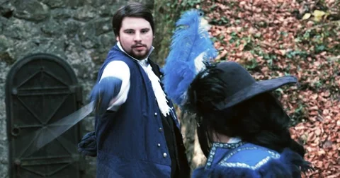 Two musketeers fencing background door | Stock Video | Pond5