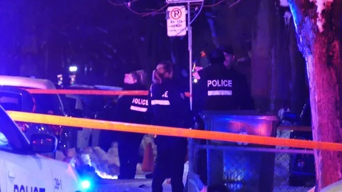 Two officers kissing at police scene | Stock Video | Pond5