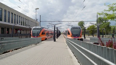 Two orange train on the railway stations... | Stock Video | Pond5