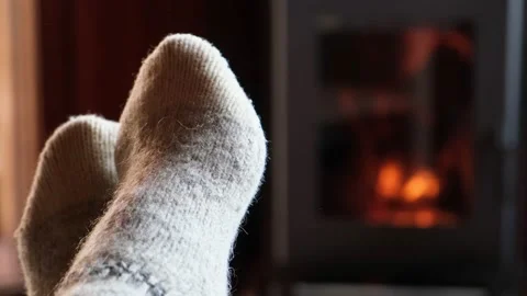Two pair feet legs in winter wool socks ... | Stock Video | Pond5
