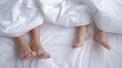 Two pair of feet next to each other in a... | Stock Video | Pond5