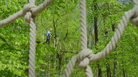 Two people in an adventure park | Stock Video | Pond5