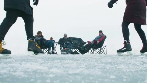Two People Ice Skating In Front Of Group... | Stock Video | Pond5