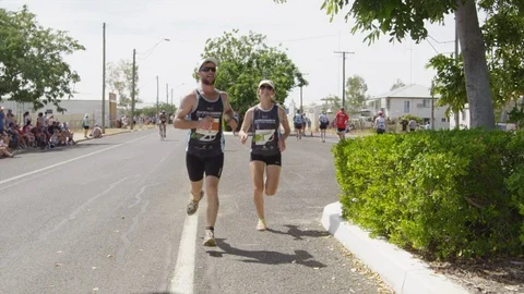 Two people running in slow motion | Stock Video | Pond5