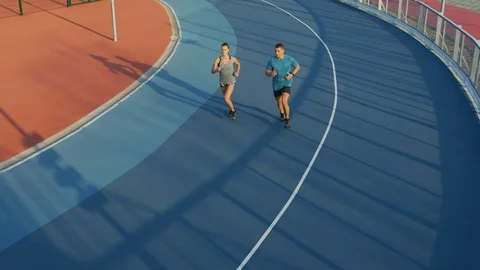 Two People Running Stock Footage ~ Royalty Free Stock Videos | Pond5