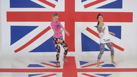 Two pretty young women are synchronicall... | Stock Video | Pond5