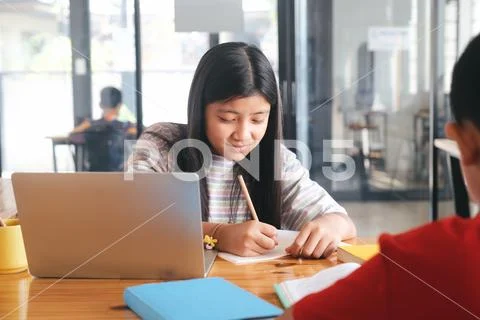 Photograph: Two primary school kids learning together. #147212072