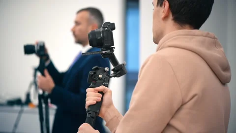 Two professional photographers shooting ... | Stock Video | Pond5