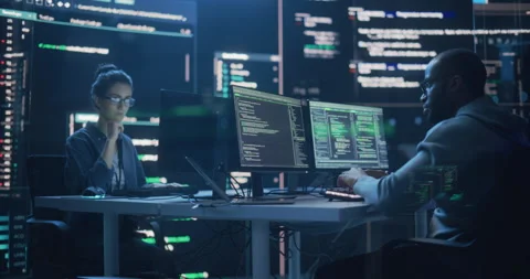 Two Programmers Writing Code Surrounded ... | Stock Video | Pond5