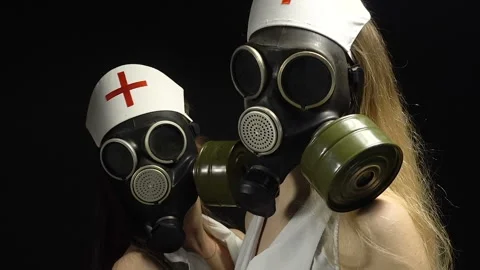 Two sexy girls in gas mask | Stock Video | Pond5