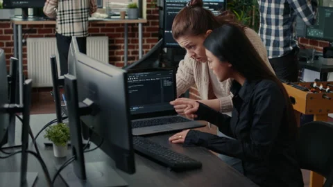 Two software engineers analyzing source ... | Stock Video | Pond5