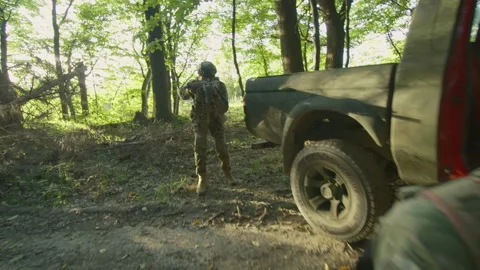 Two soldiers in uniform with guns gettin... | Stock Video | Pond5