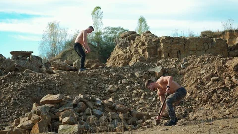 Two sportsmen breaking stones outdoors. ... | Stock Video | Pond5