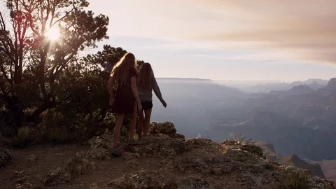 Two teenage girls walking to the edge of... | Stock Video | Pond5
