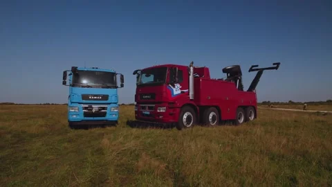 Two tow trucks, car tow trucks, aerial p... | Stock Video | Pond5