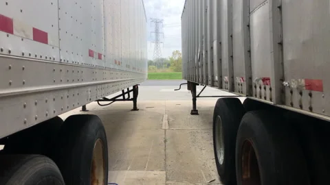 Two Truck trailers Parked At Loading Doc... | Stock Video | Pond5