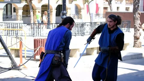 Two warriors dressed in medieval clothes... | Stock Video | Pond5