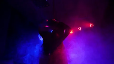 Two women dancing around the pole by the... | Stock Video | Pond5