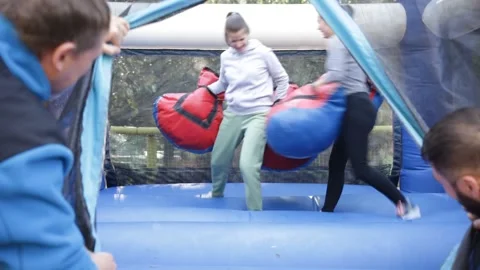 Two women having funny battle by big box... | Stock Video | Pond5